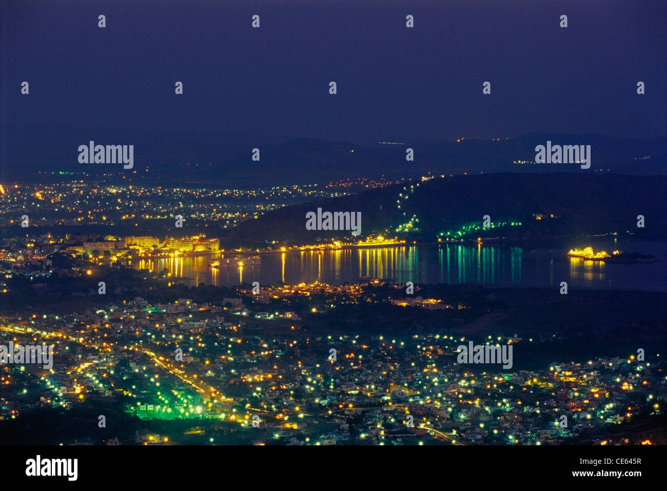 Illuminated night aerial view of Udaipur city from Monsoon Palace ...
