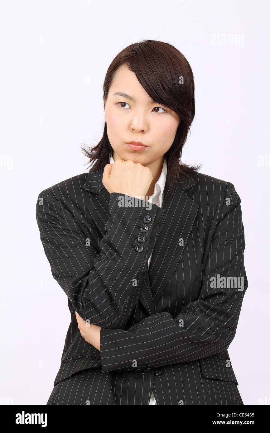 Portrait of young asian business woman thinking Stock Photo - Alamy