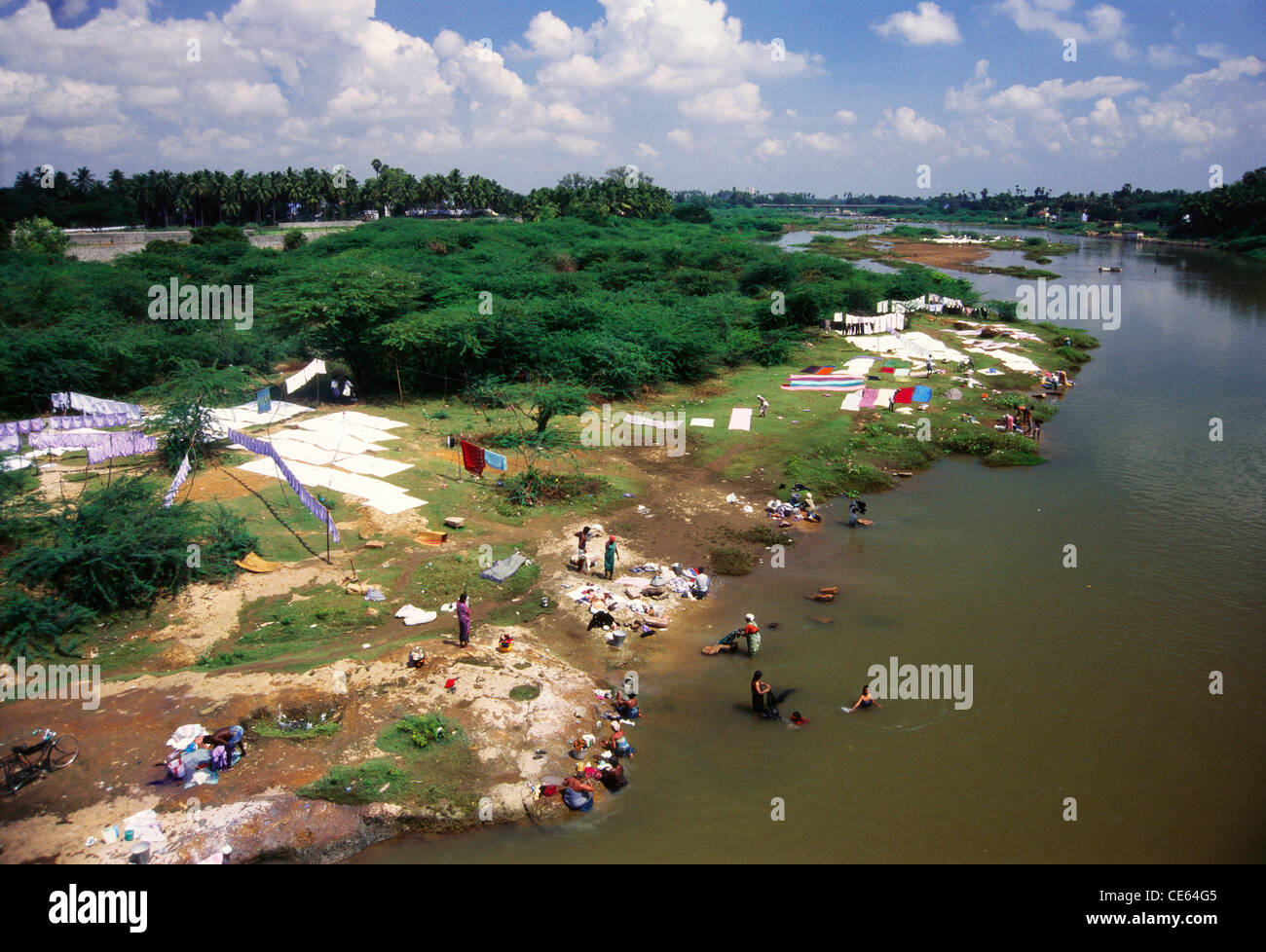 Women washing laundry clothes ; Thamirabarani river ; Tamraparni river ...