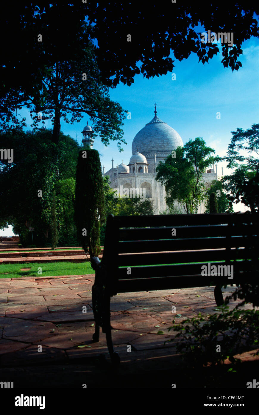 Taj Mahal with garden bench ; white marble mausoleum ; Mughal ...
