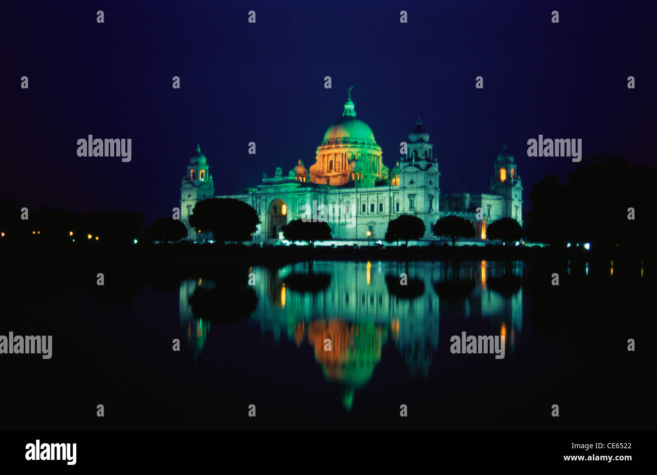 Night view of Victoria Memorial reflection in pond ; Calcutta ; West ...