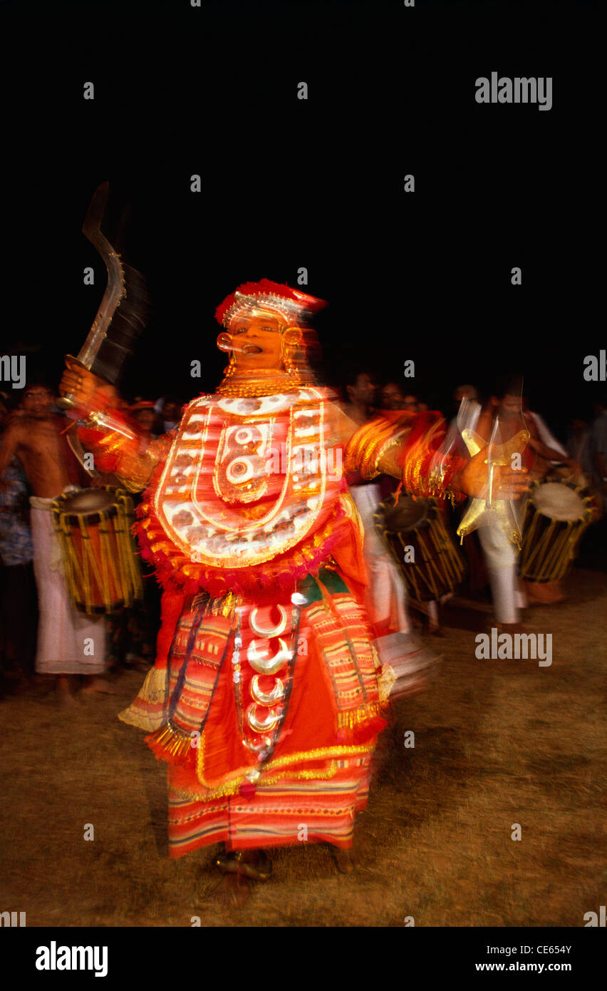 Dancer performing classical Theyam ritual dance ; Kudali ; Kerala ...