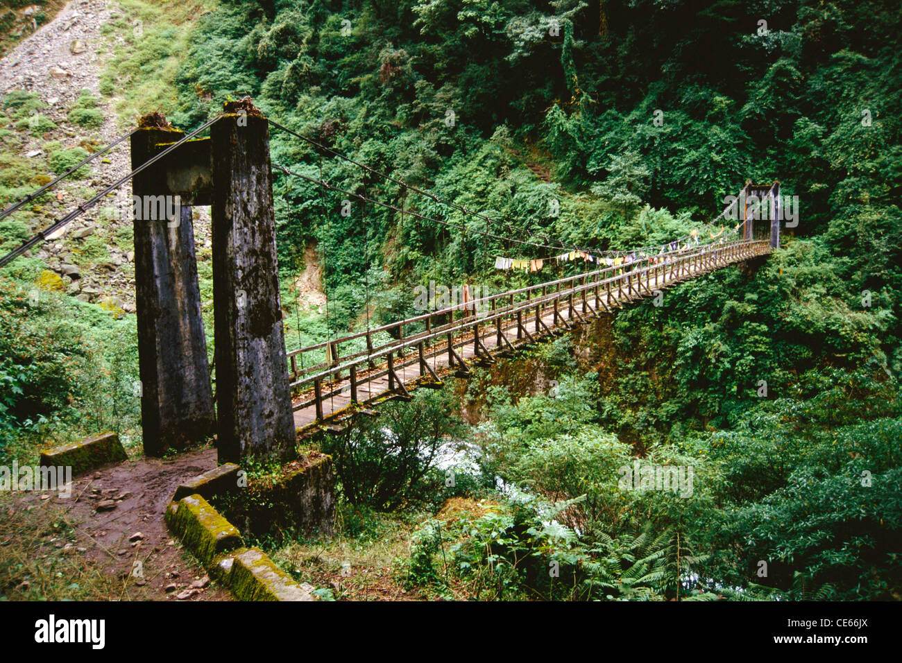 Old suspension bridge over Rathong Chu River ; Yoksum ; Yuksom ...