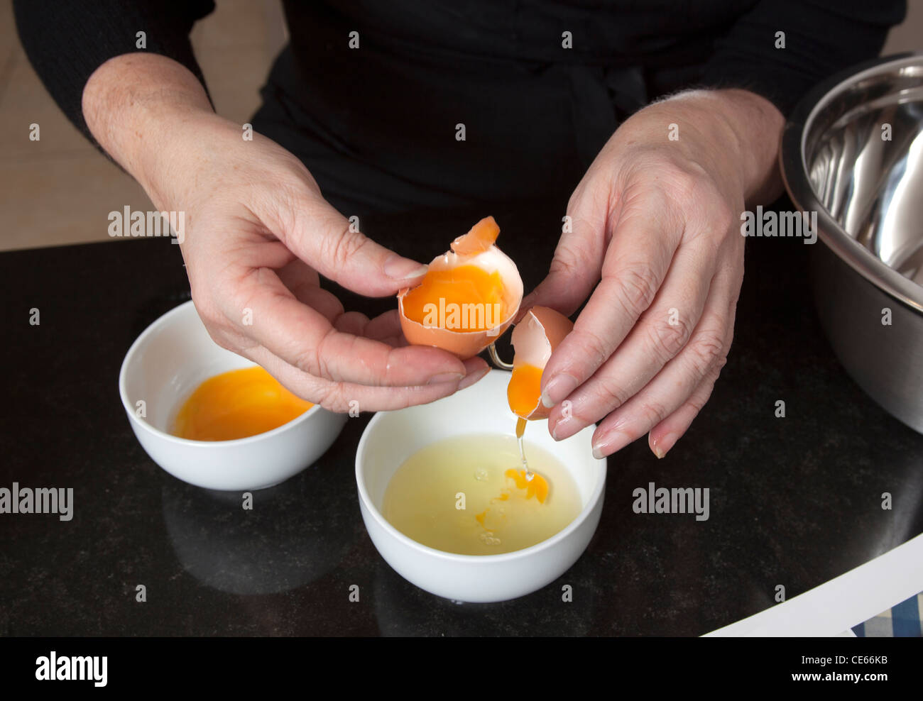 A Chef Separating Eggs in Kitchen Stock Photo - Alamy