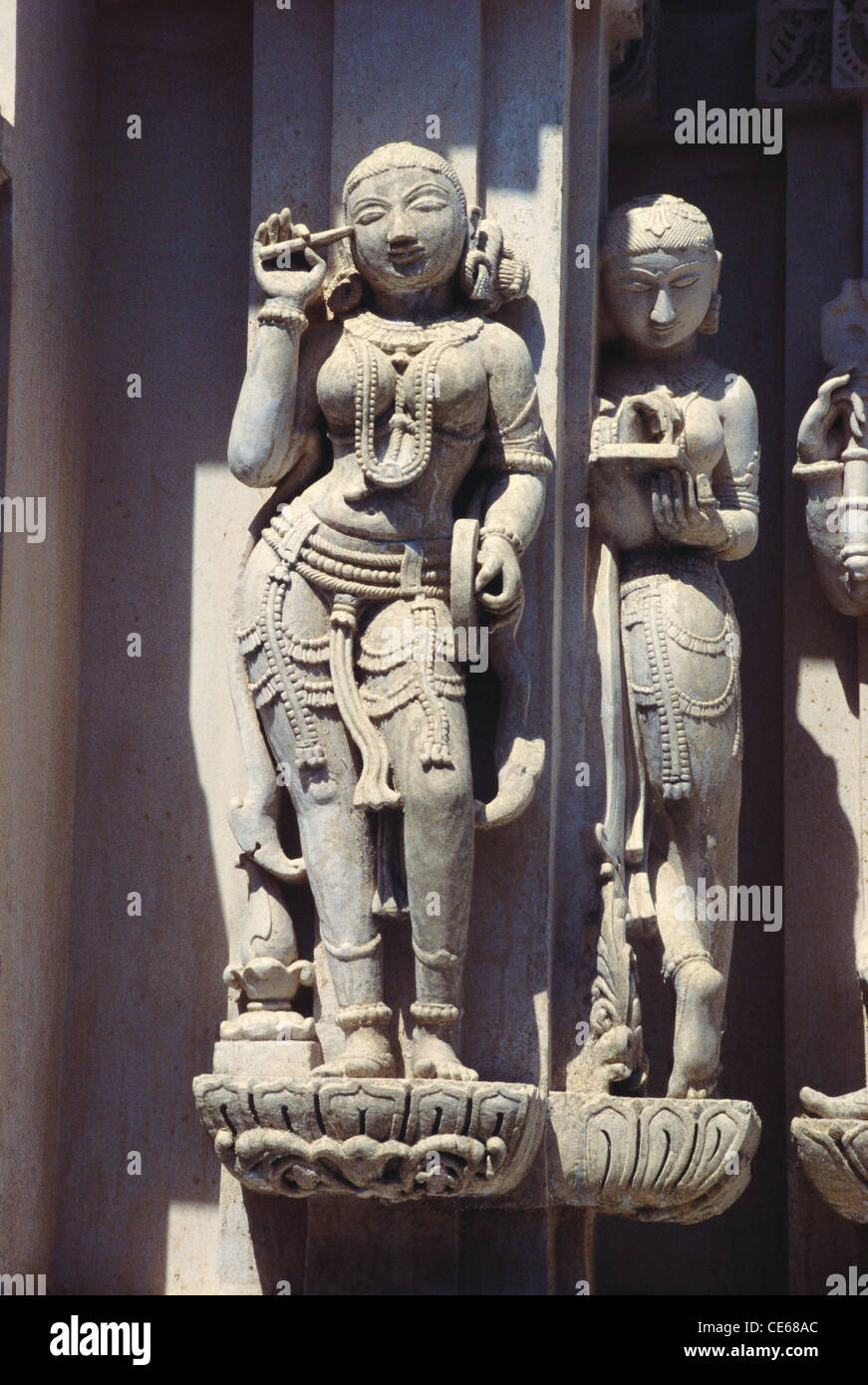 Lady applying kajal eye liner in eye ; Palitana ; Gujarat ; India Stock ...
