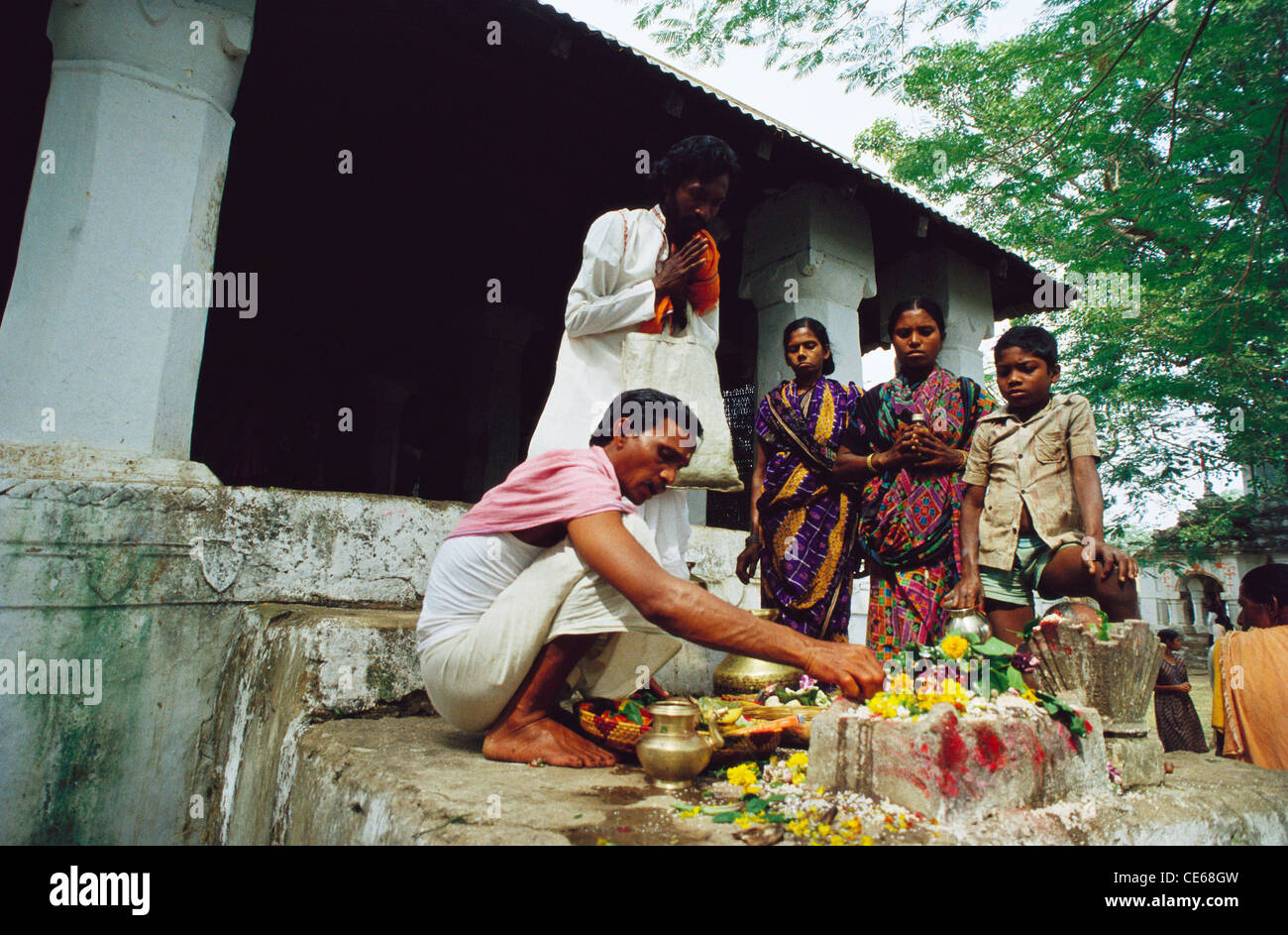Priest praying puja ; Puri ; Orissa ; Odisha ; India ; Asia Stock Photo ...