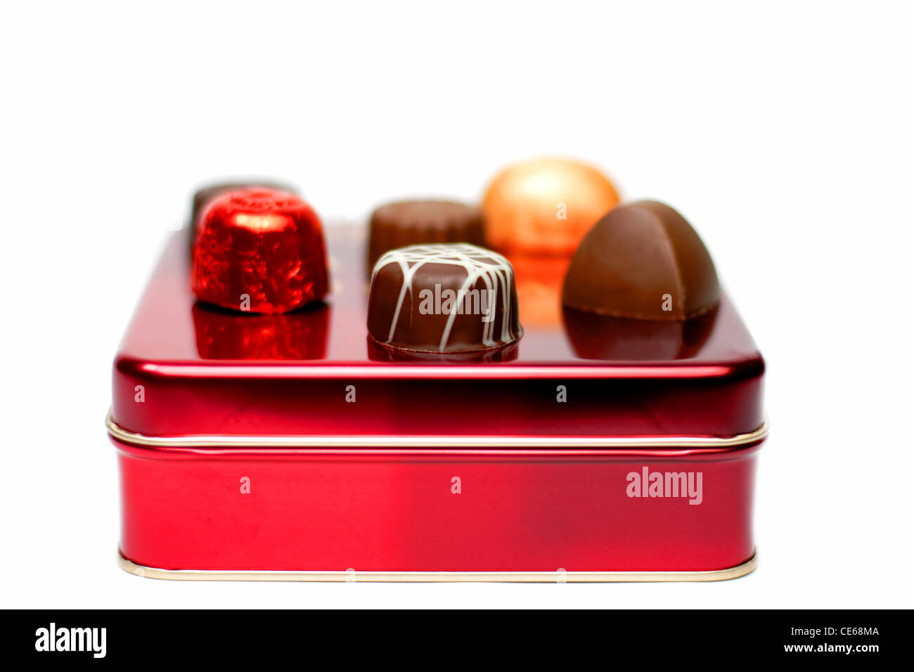 Assorted chocolates on a red box over white background Stock Photo - Alamy