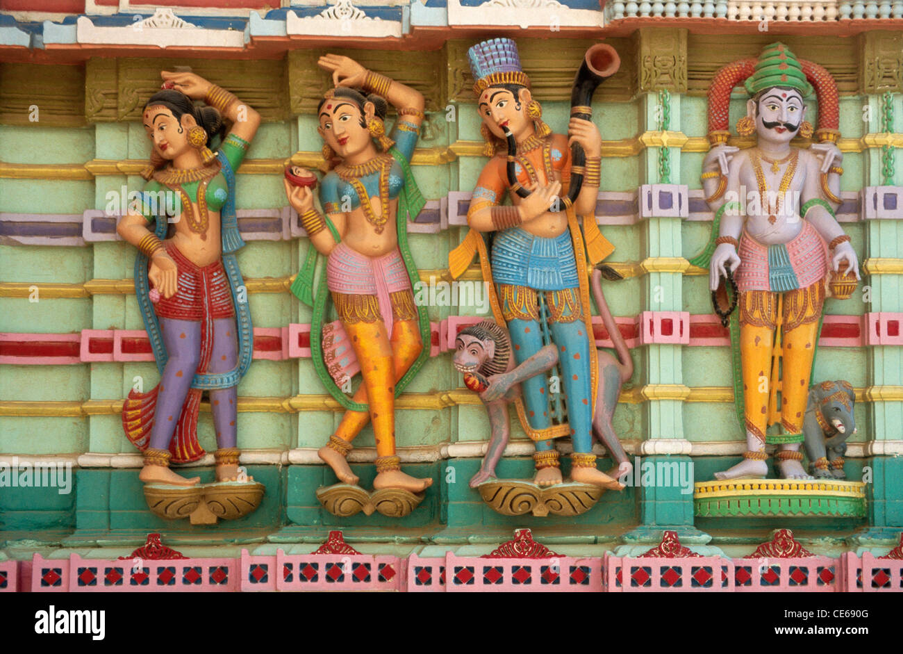 Sculpture of women dancing and playing musical instrument in front of ...