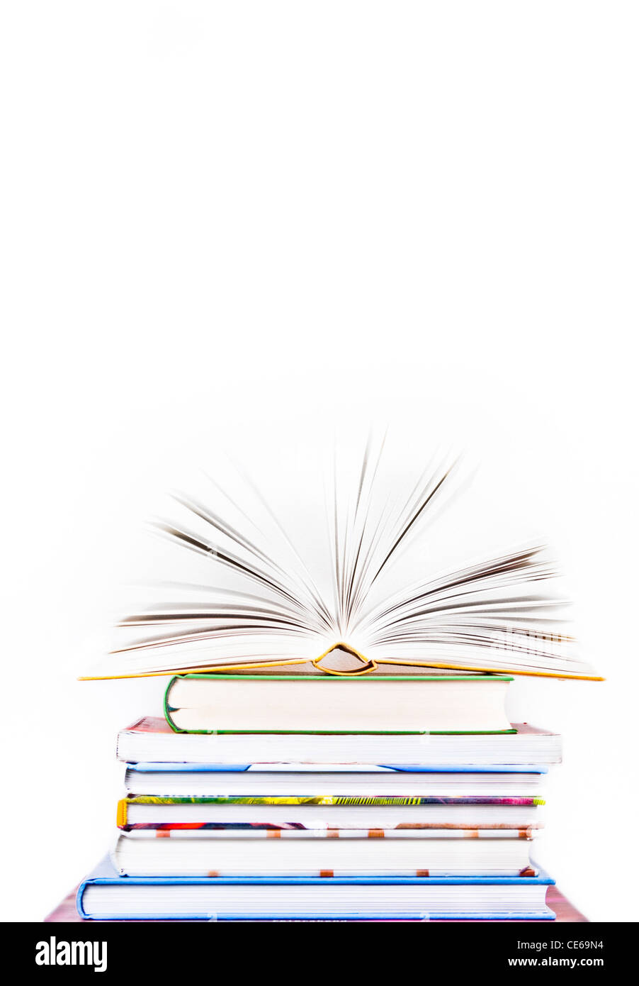 An open book on a stack of books Stock Photo - Alamy