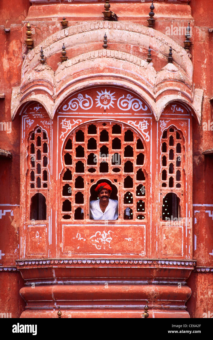Rajasthani man viewing from window of Hawa Mahal Palace of wind ...