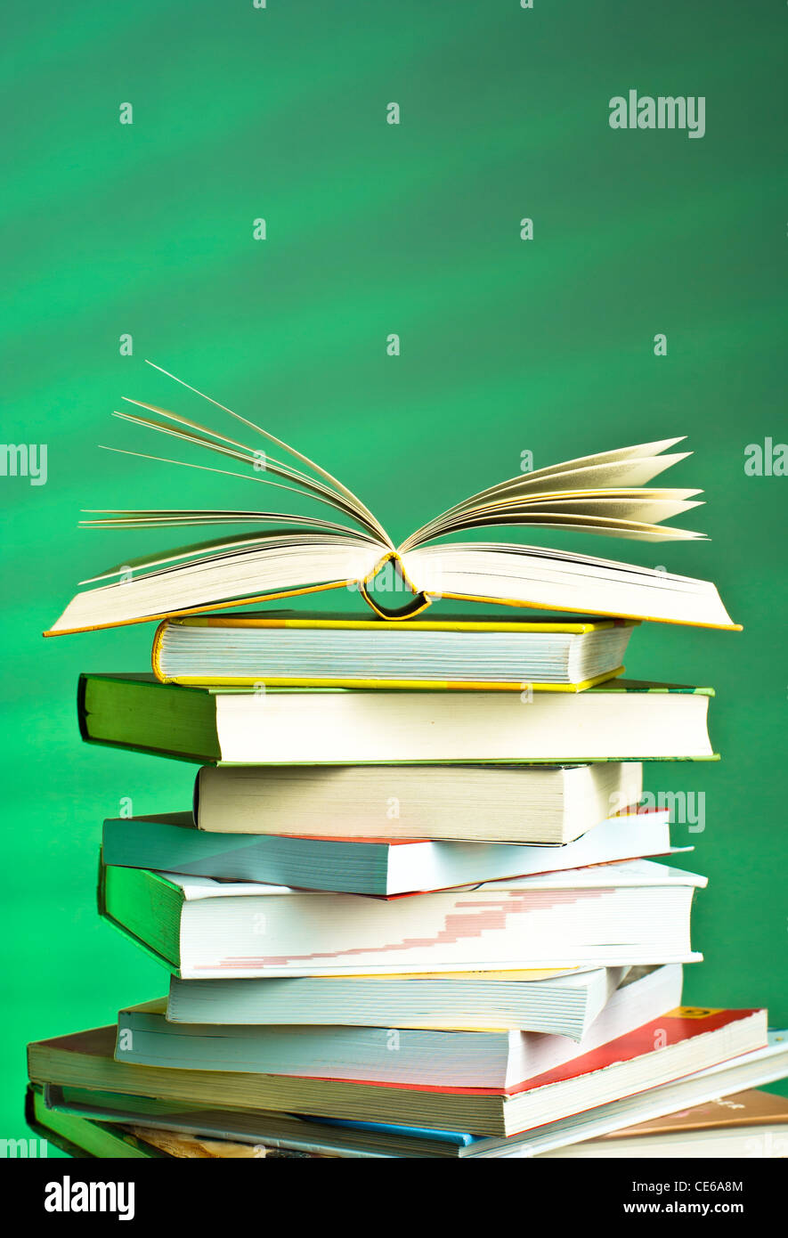 An open book on a stack of books Stock Photo - Alamy