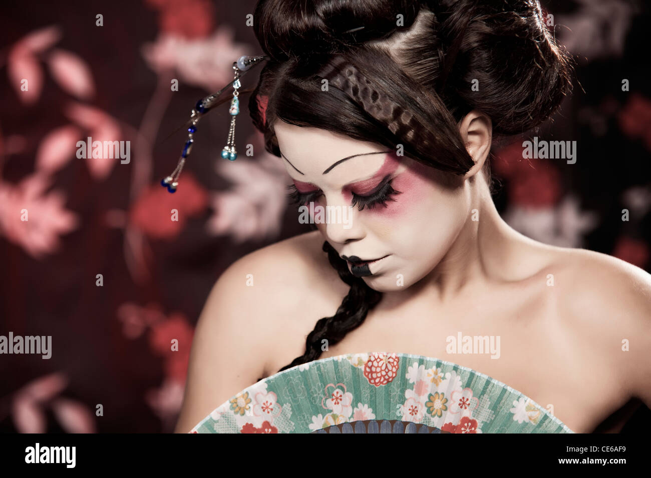 stylized picture of a Japanese geisha, make-up done by professional ...