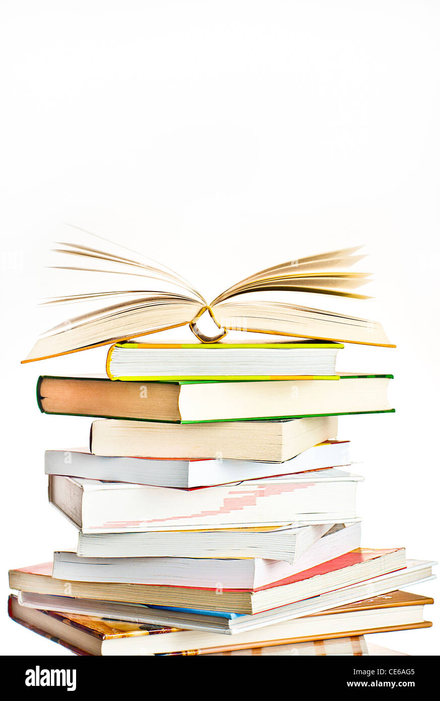 An open book on a stack of books Stock Photo - Alamy