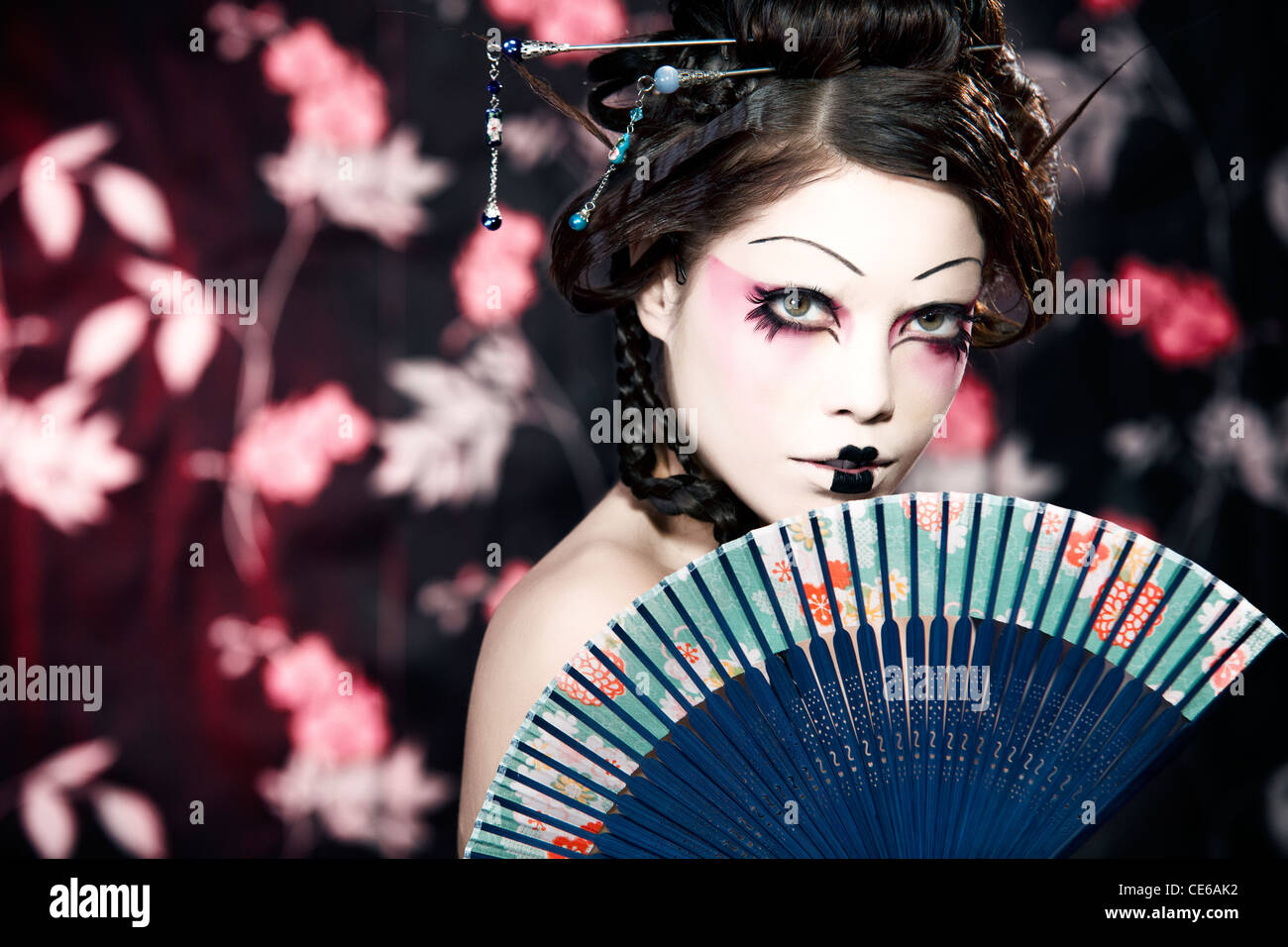 stylized picture of a Japanese geisha, make-up done by professional ...
