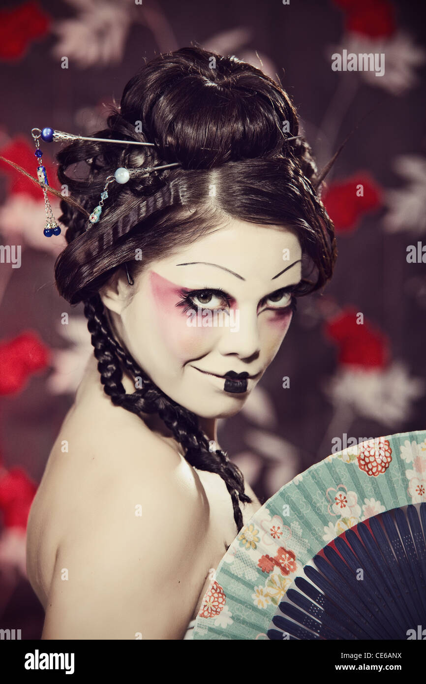 stylized picture of a Japanese geisha, make-up done by professional ...