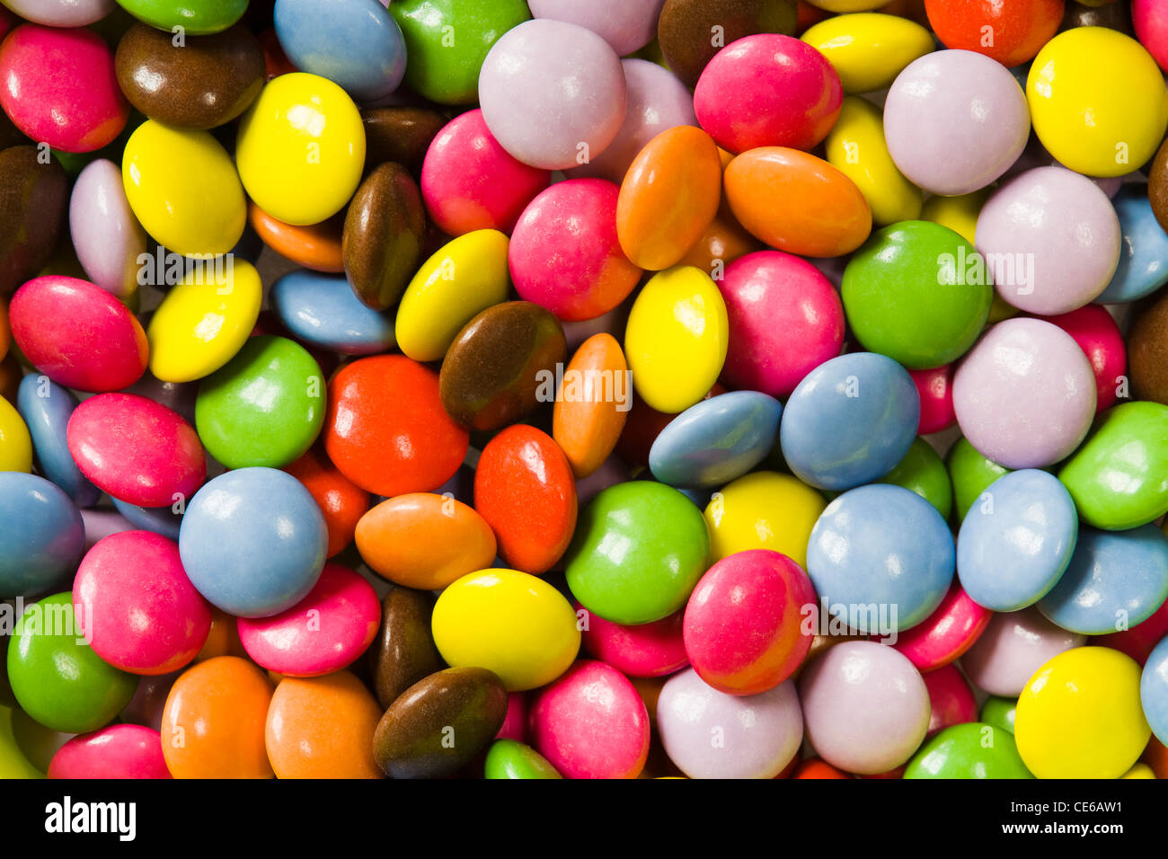 Multi coloured smarties sweets candy close hi-res stock photography and ...