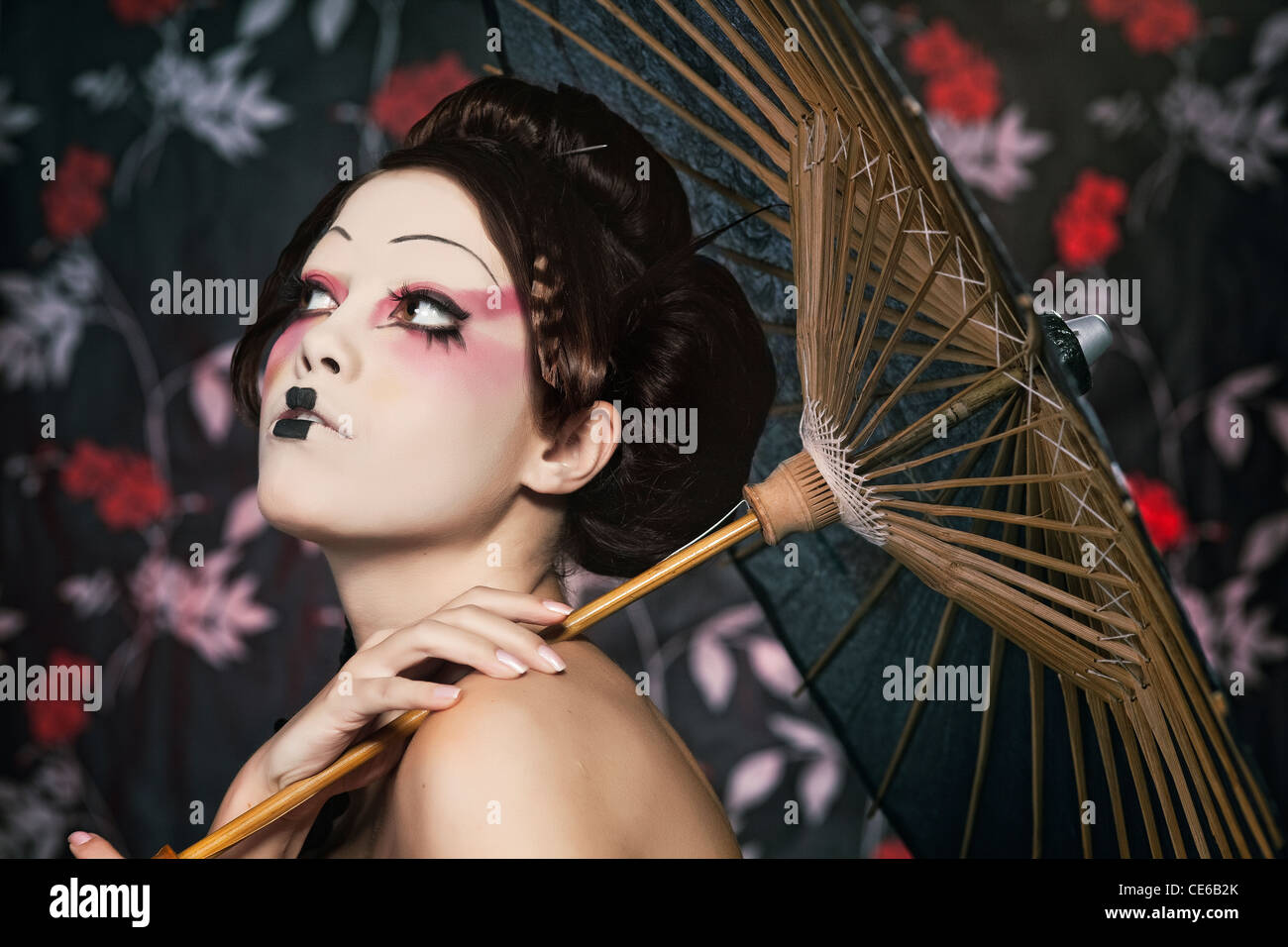 stylized picture of a Japanese geisha, make-up done by professional ...