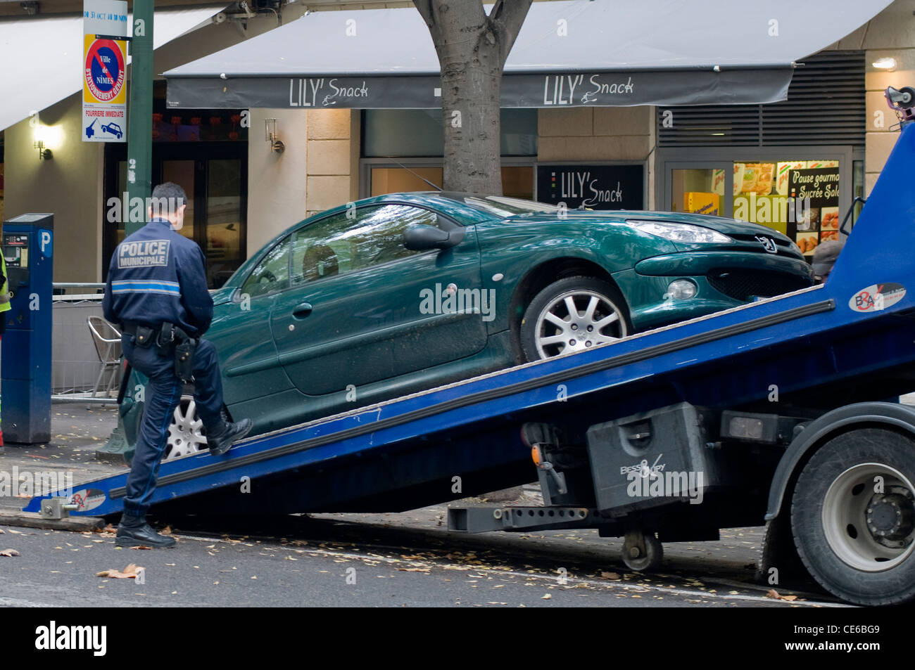 Traffic Police removing parked car in Nimes,France,Europe Stock Photo ...