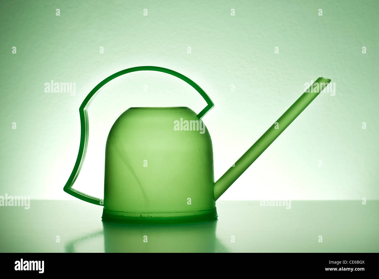 A watering pot on a white background Stock Photo - Alamy