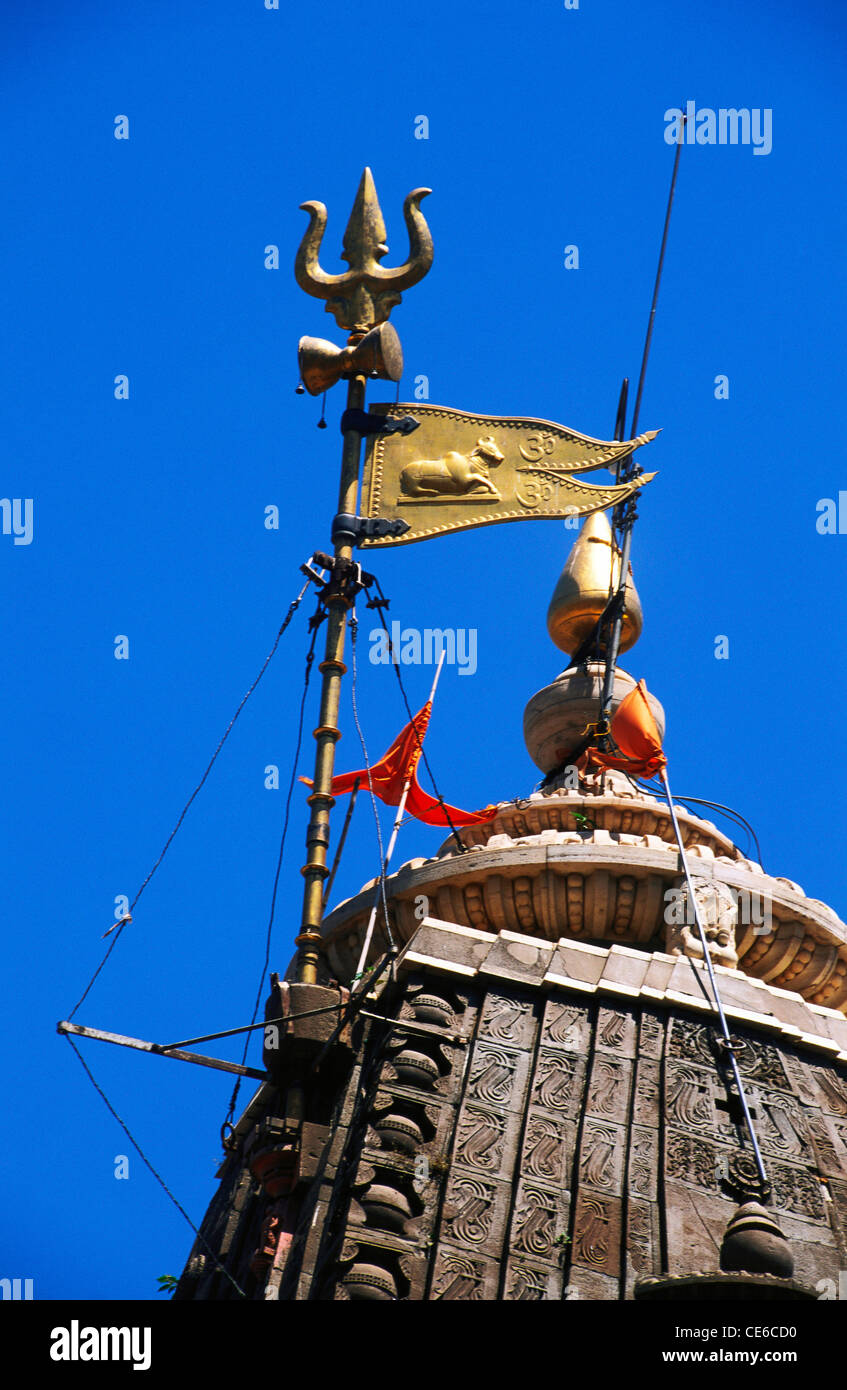 Golden trident and flag on top of Shiva temple 10th Jyotirling ...