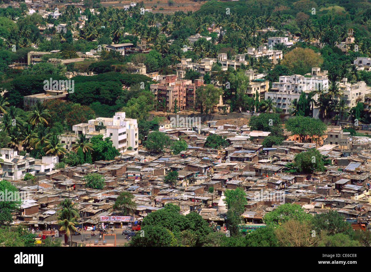 Aerial view of slums and buildings contrast rich and poor ; Pune ...