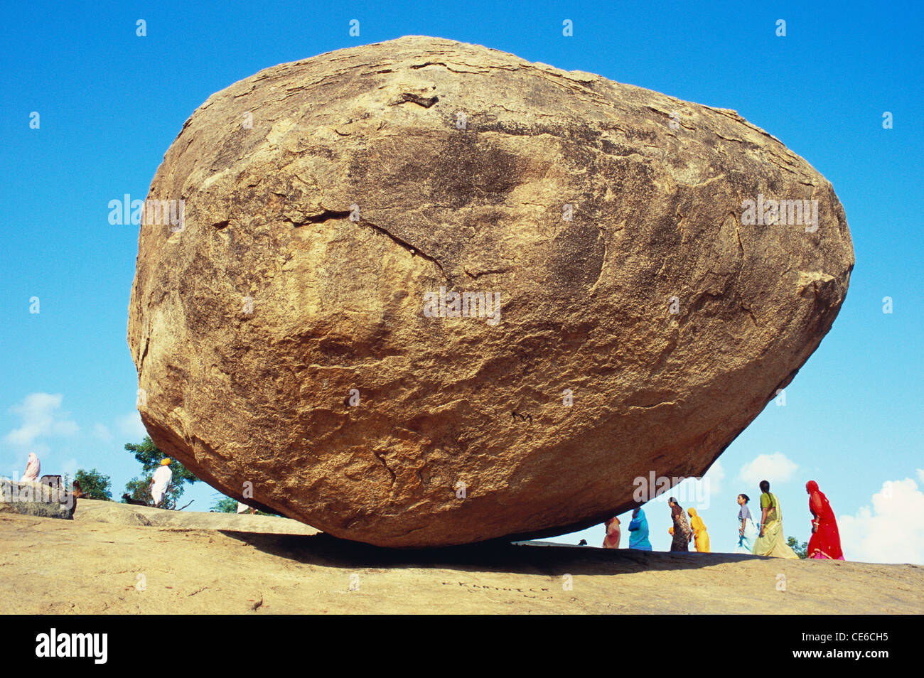 Krishnas Butter Ball ; balancing gigantic granite boulder rock ...