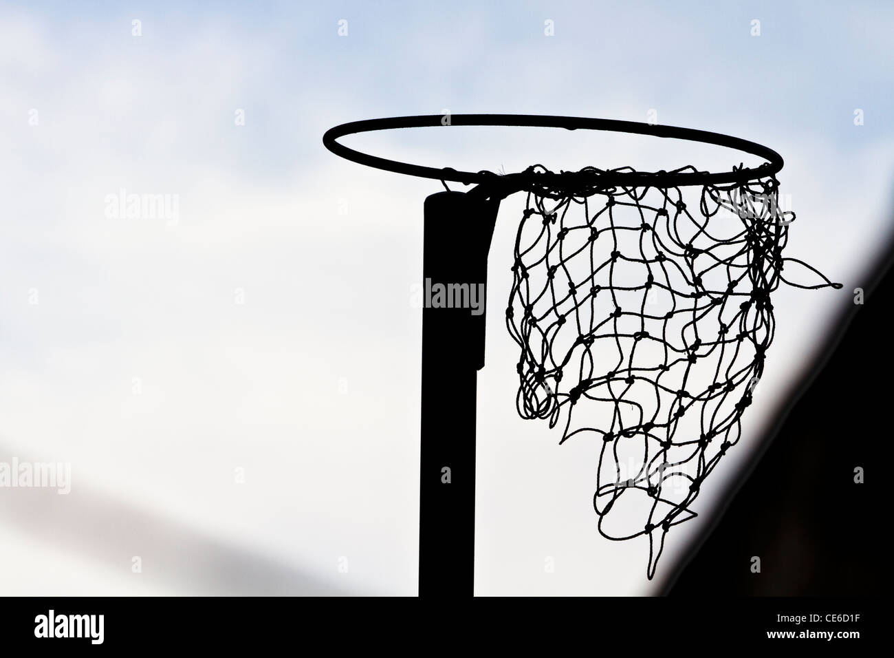 Basketball hoop with a broken net Stock Photo - Alamy