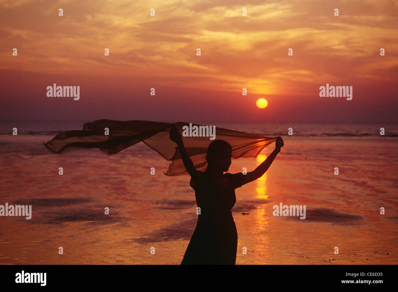 Woman silhouette beach sunset sheer hi-res stock photography and images ...