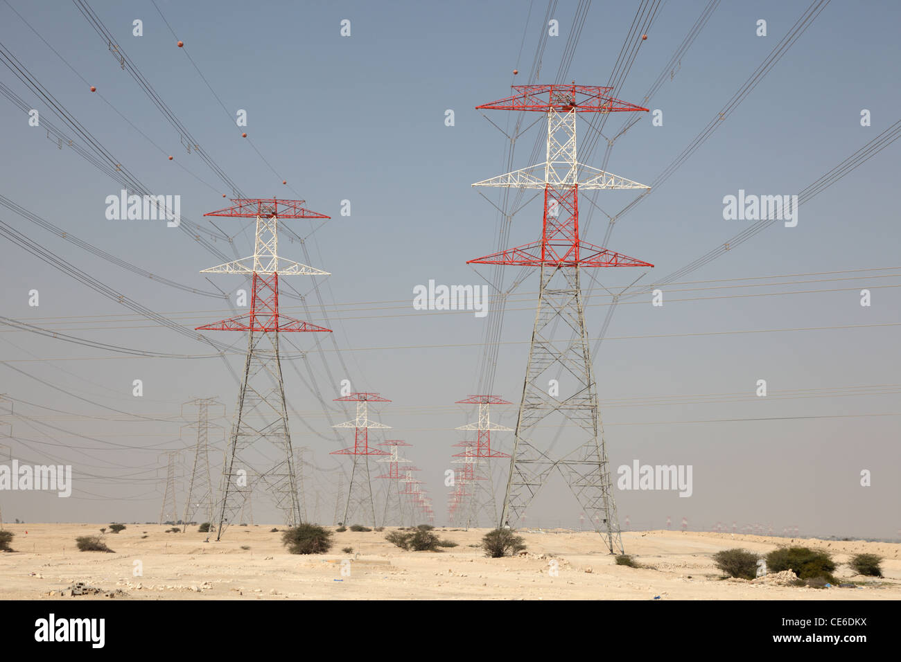 High voltage transmission towers in the desert of Qatar Stock Photo - Alamy