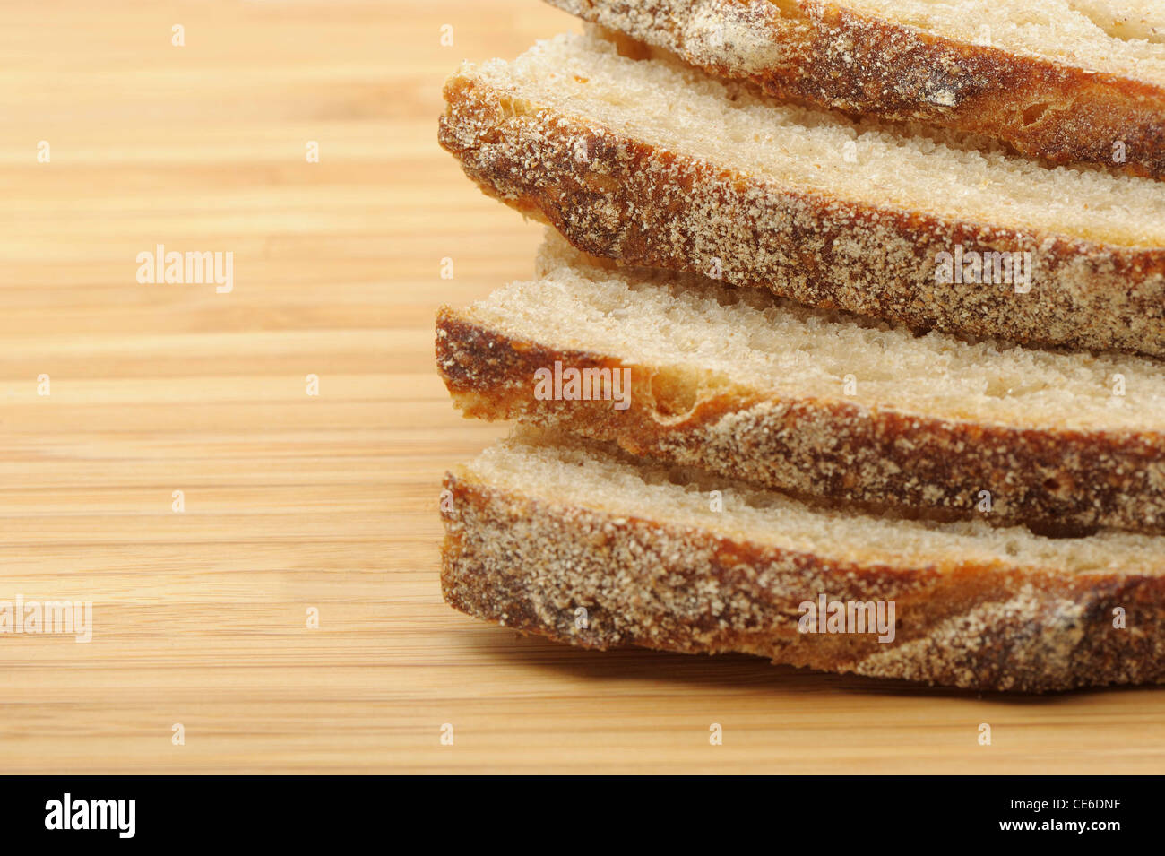 The cut bread on a chopping board. Photo closeup Stock Photo - Alamy