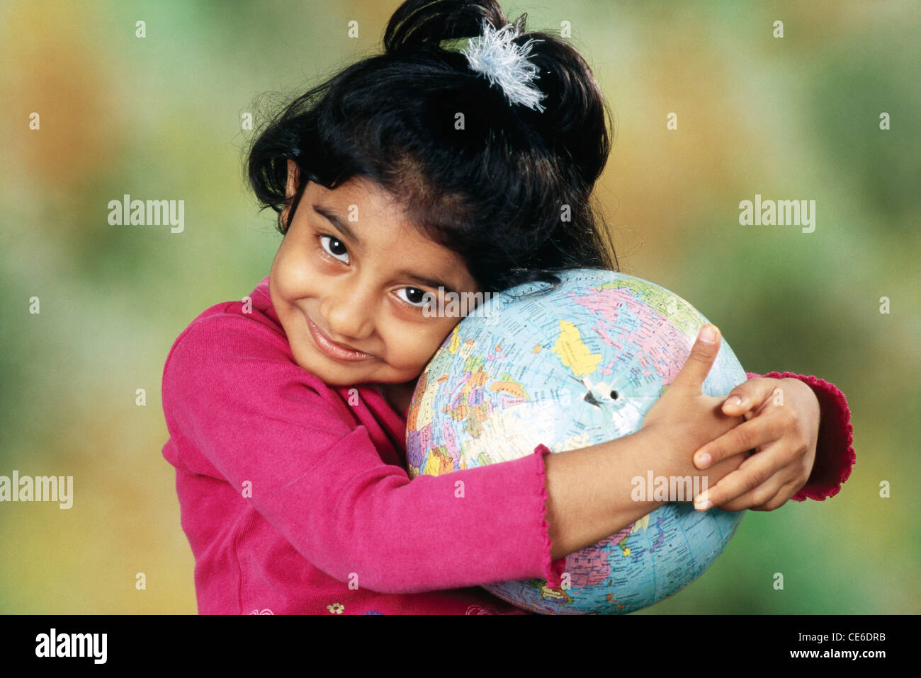 girl holding world globe in hand MR#152 Stock Photo - Alamy