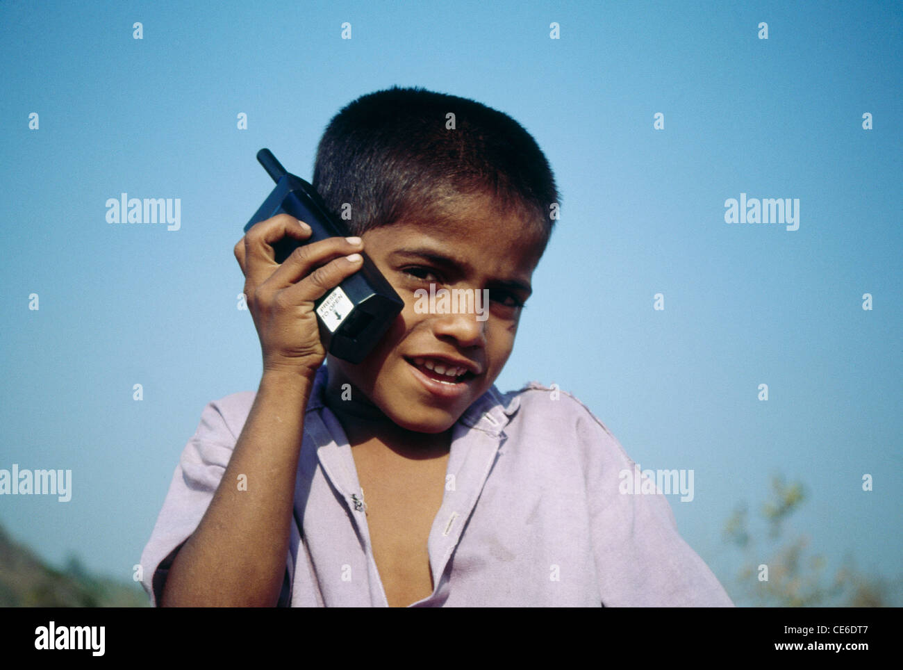 boy talking on mobile phone Stock Photo - Alamy