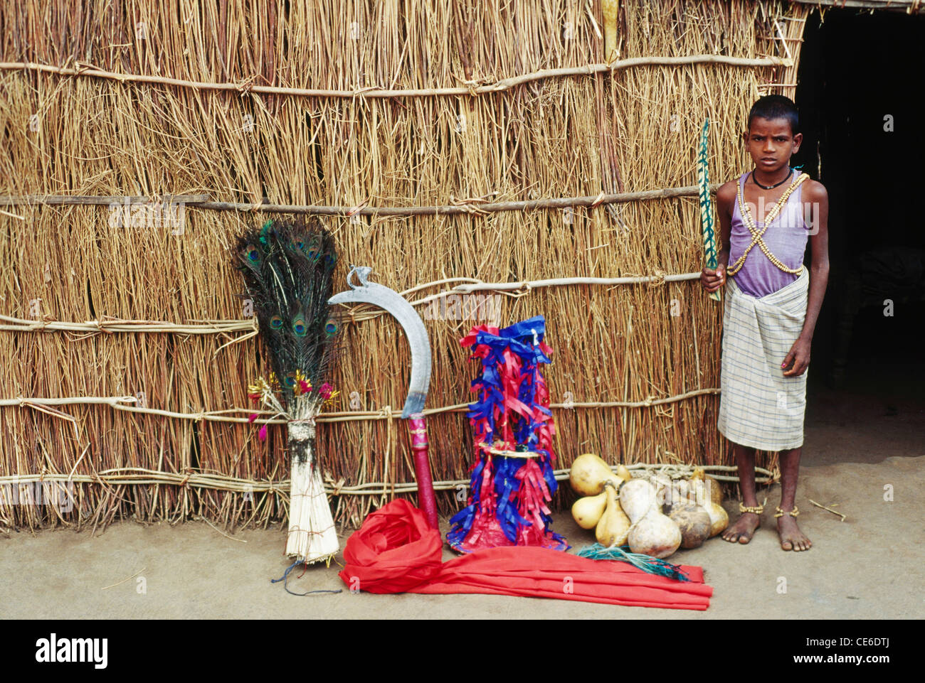 Tribal boy preparing for holi festival ; Pawra bhilla ; kathi ...