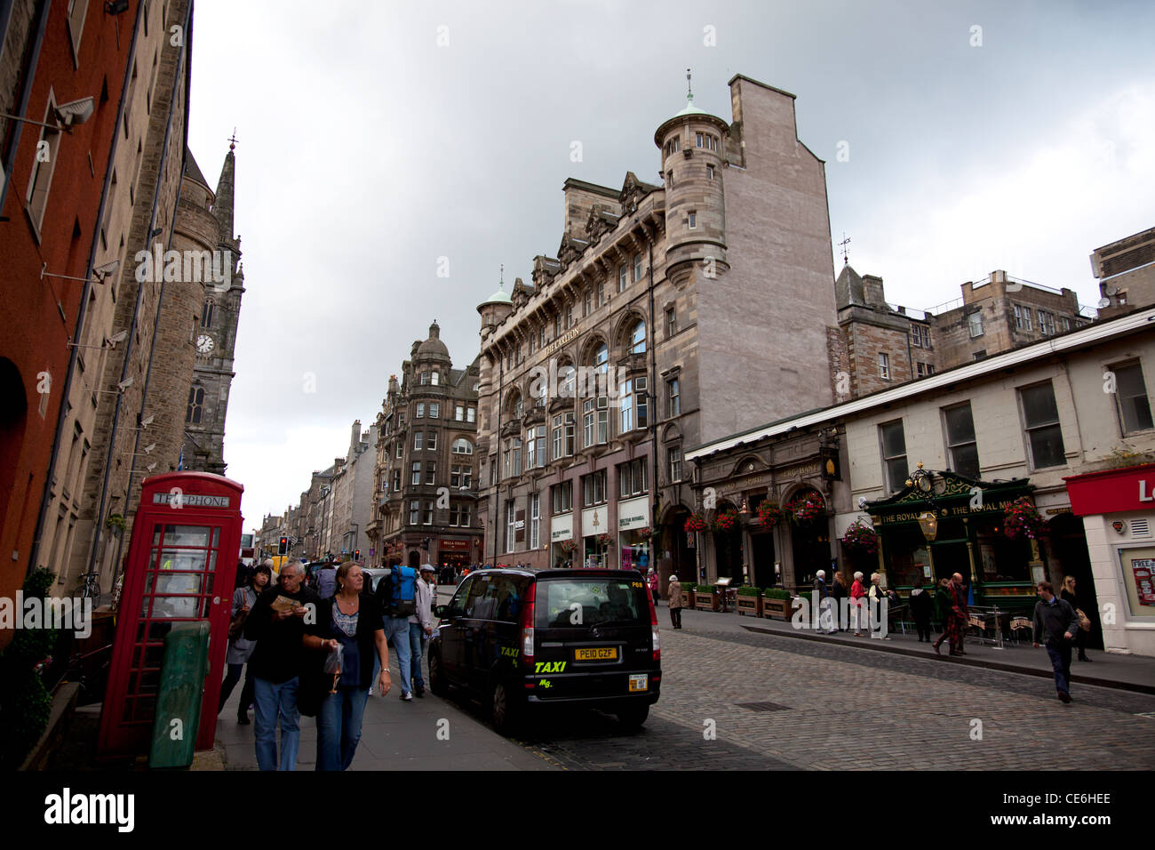 Shops and bars on the High Street looking towards the Cathedral and ...