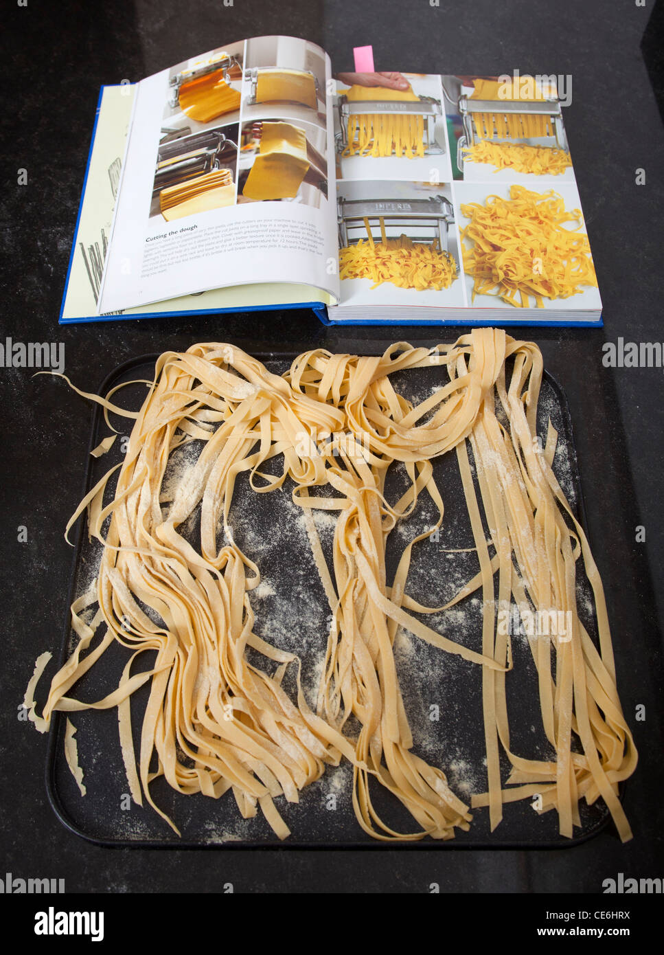 Freshly made pasta with cookbook instructions Stock Photo - Alamy
