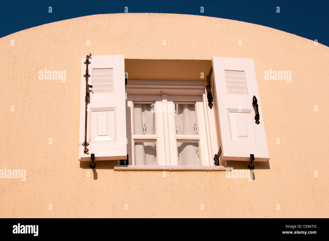 Sunshine yellow window open shutters hi-res stock photography and ...