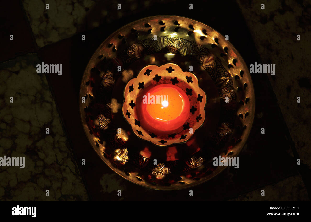 Top view of candle in bronze bowl Stock Photo - Alamy