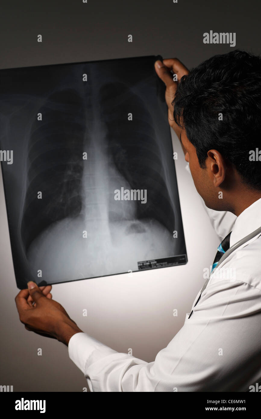 Back shot of doctor holding X ray Stock Photo - Alamy