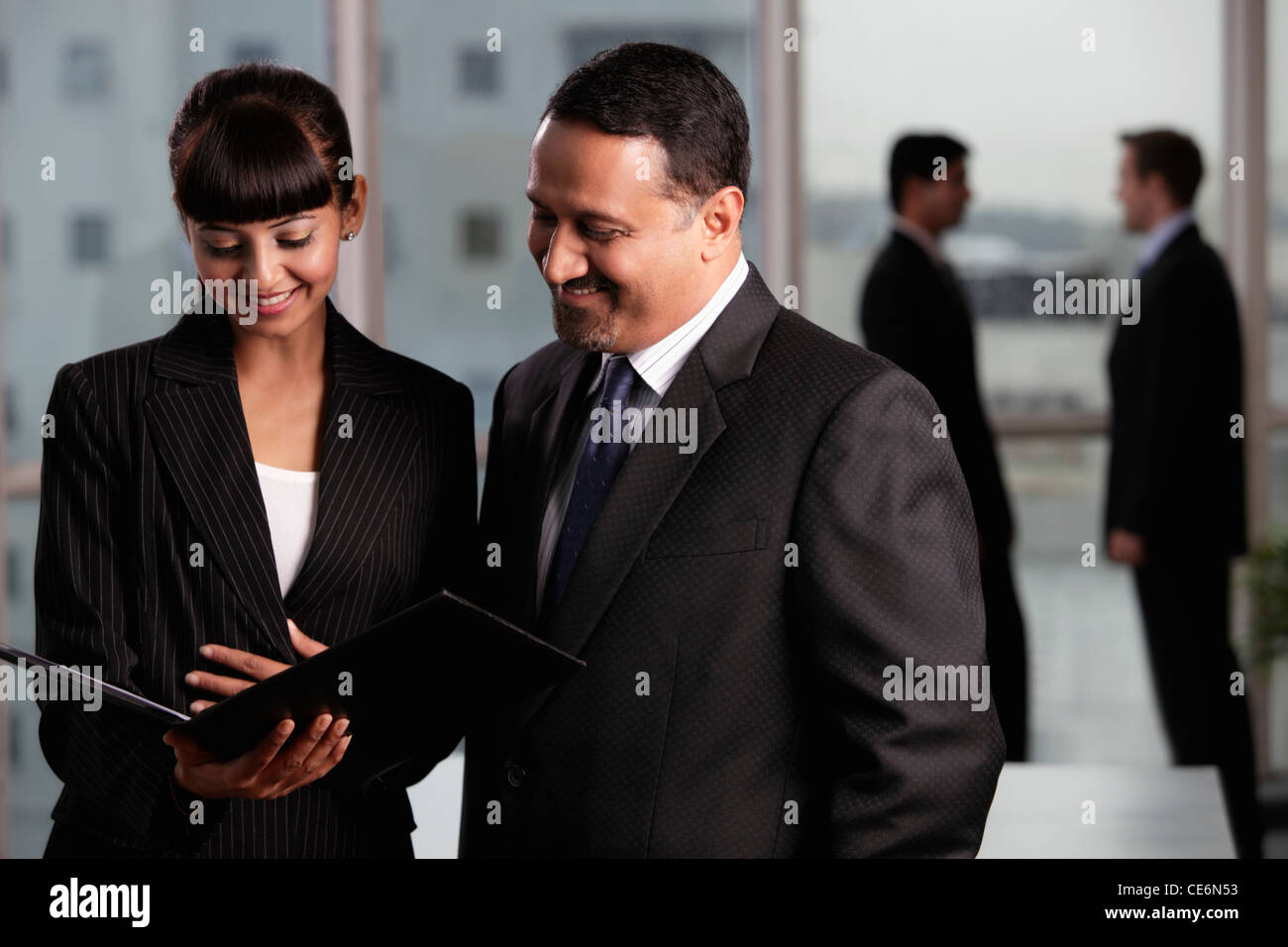 Indian colleagues discussing work Stock Photo - Alamy