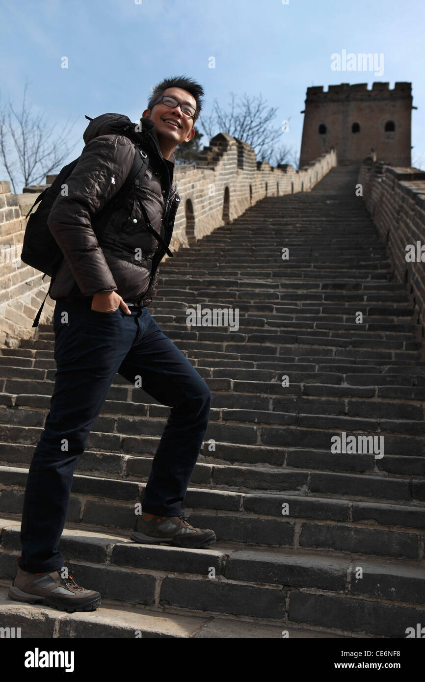 Chinese man walking up stairs on The Great Wall of China Stock Photo ...