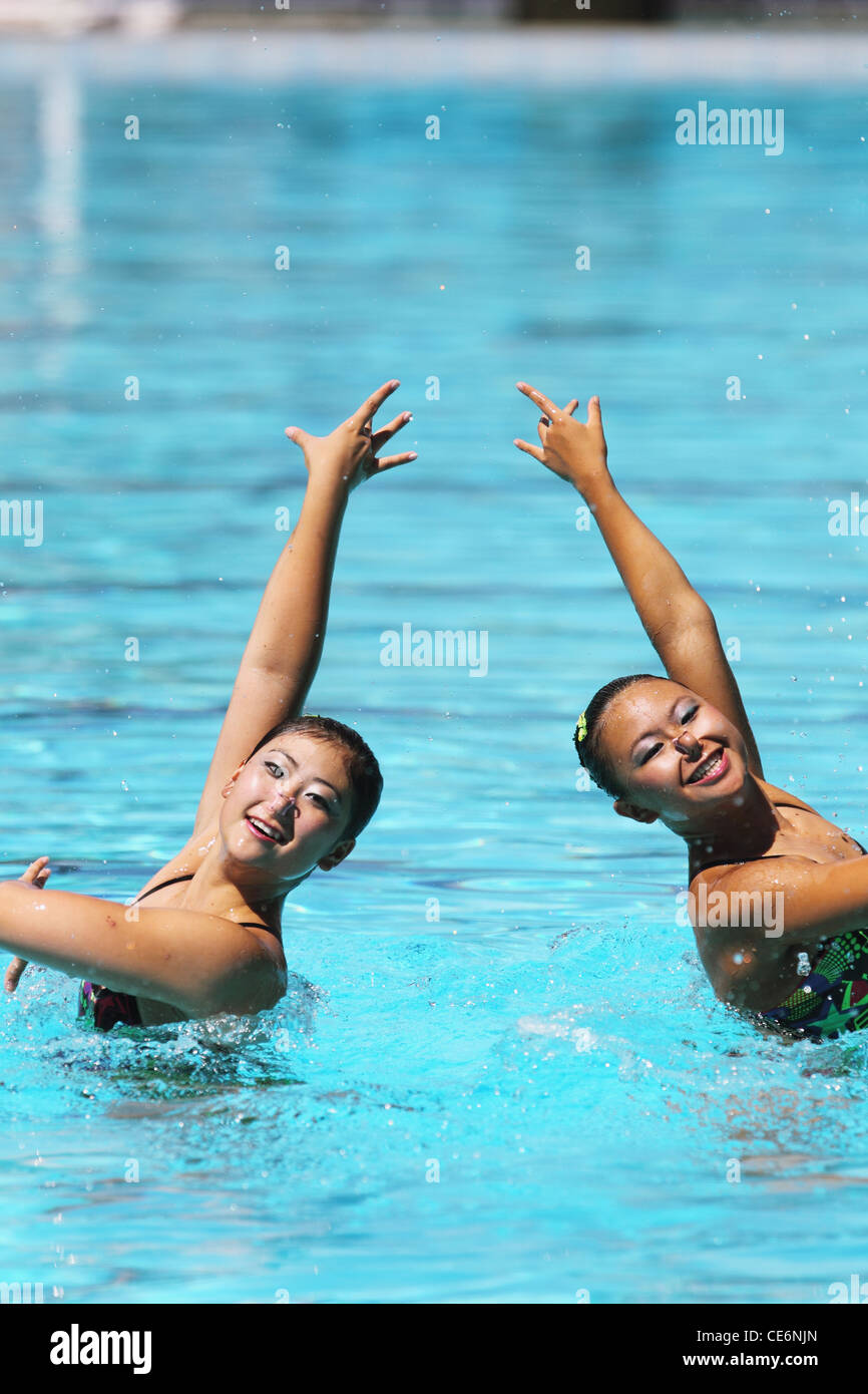 Swimmers Performing in Swimming Pool, Synchronized Swimming Stock Photo ... Swimmers Performing in Swimming Pool, Synchronized Swimming Stock Photo ...