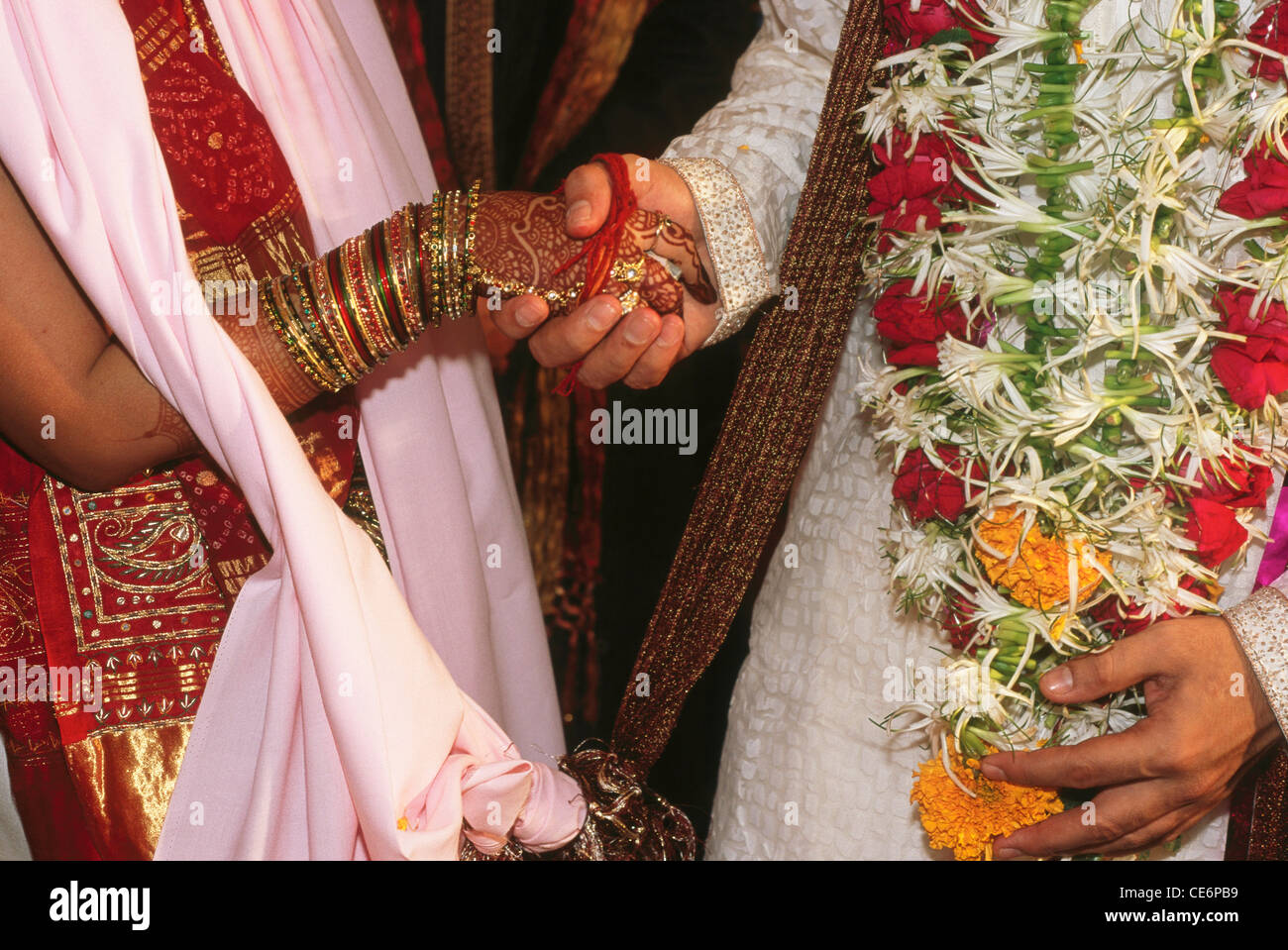 Bride and bridegroom holding hands in Indian marriage ceremony wedding ...