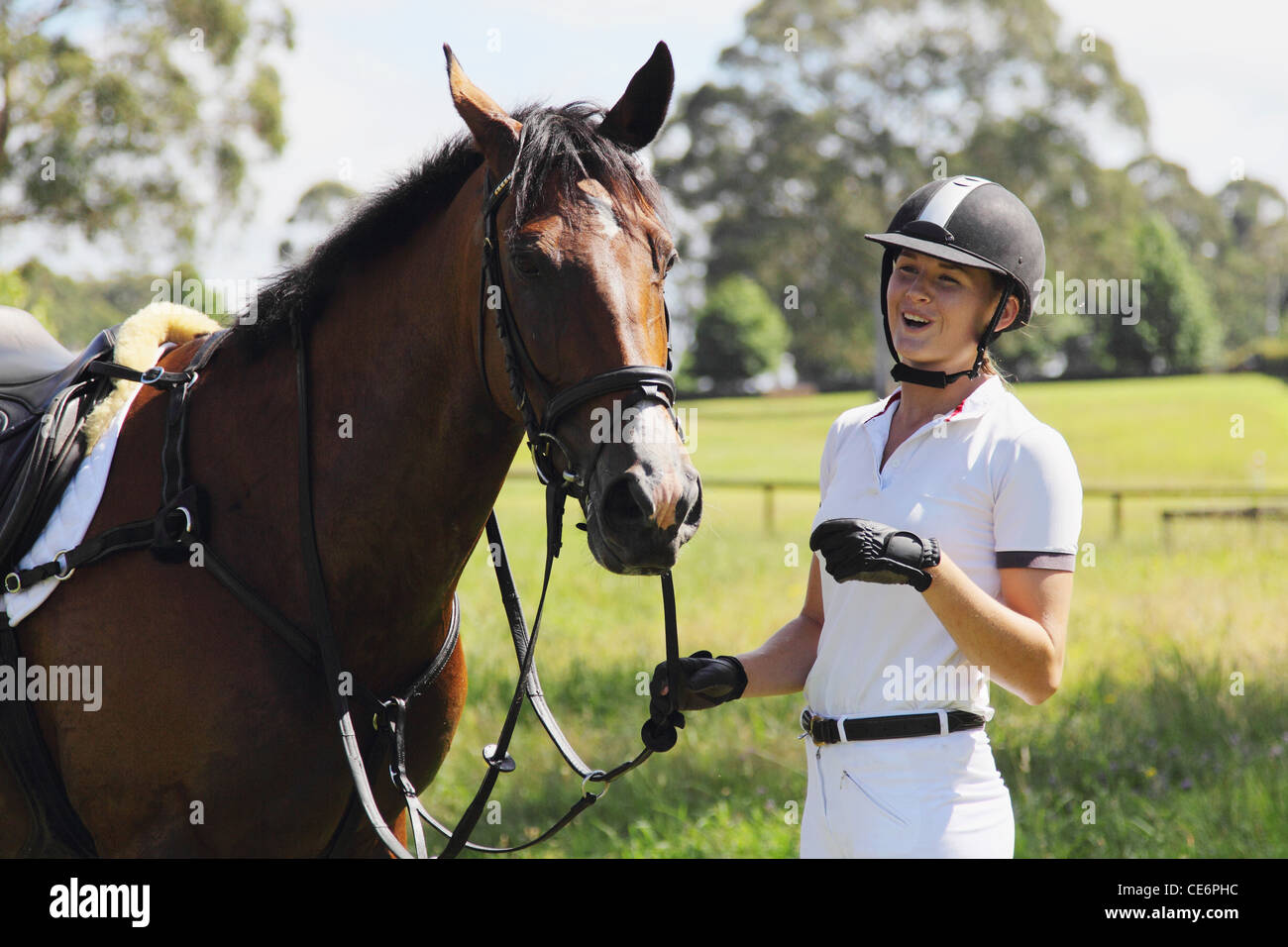 Young Horseback Rider Smiling Stock Photo - Alamy