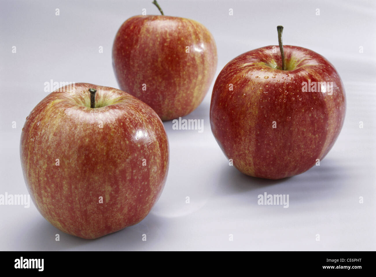 Red Apple fruit ; Red Apples ; three red apples on white background ...