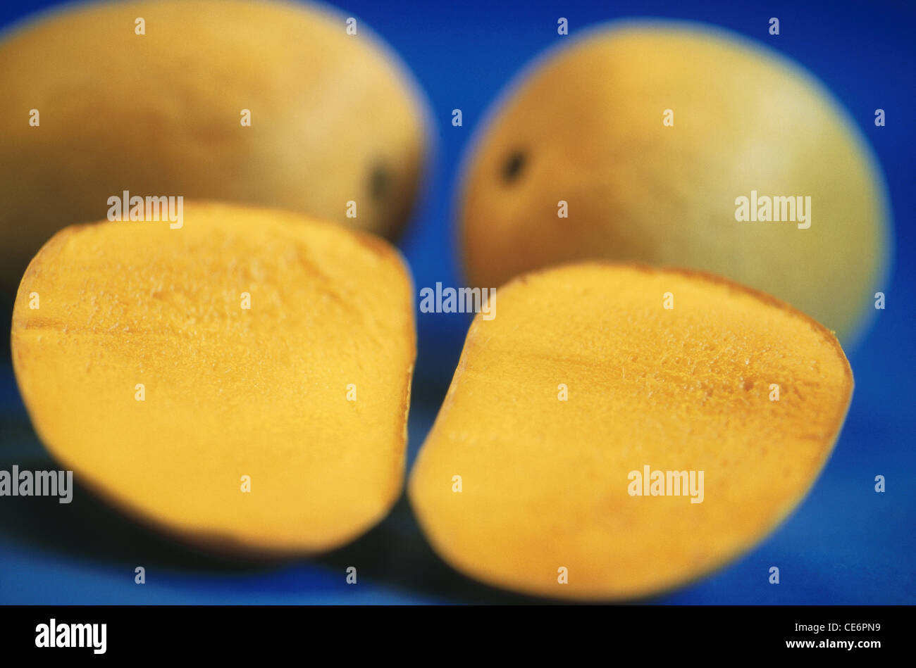 Alphonso Mango fruit two full and two slices ; India ; Asia Stock Photo ...