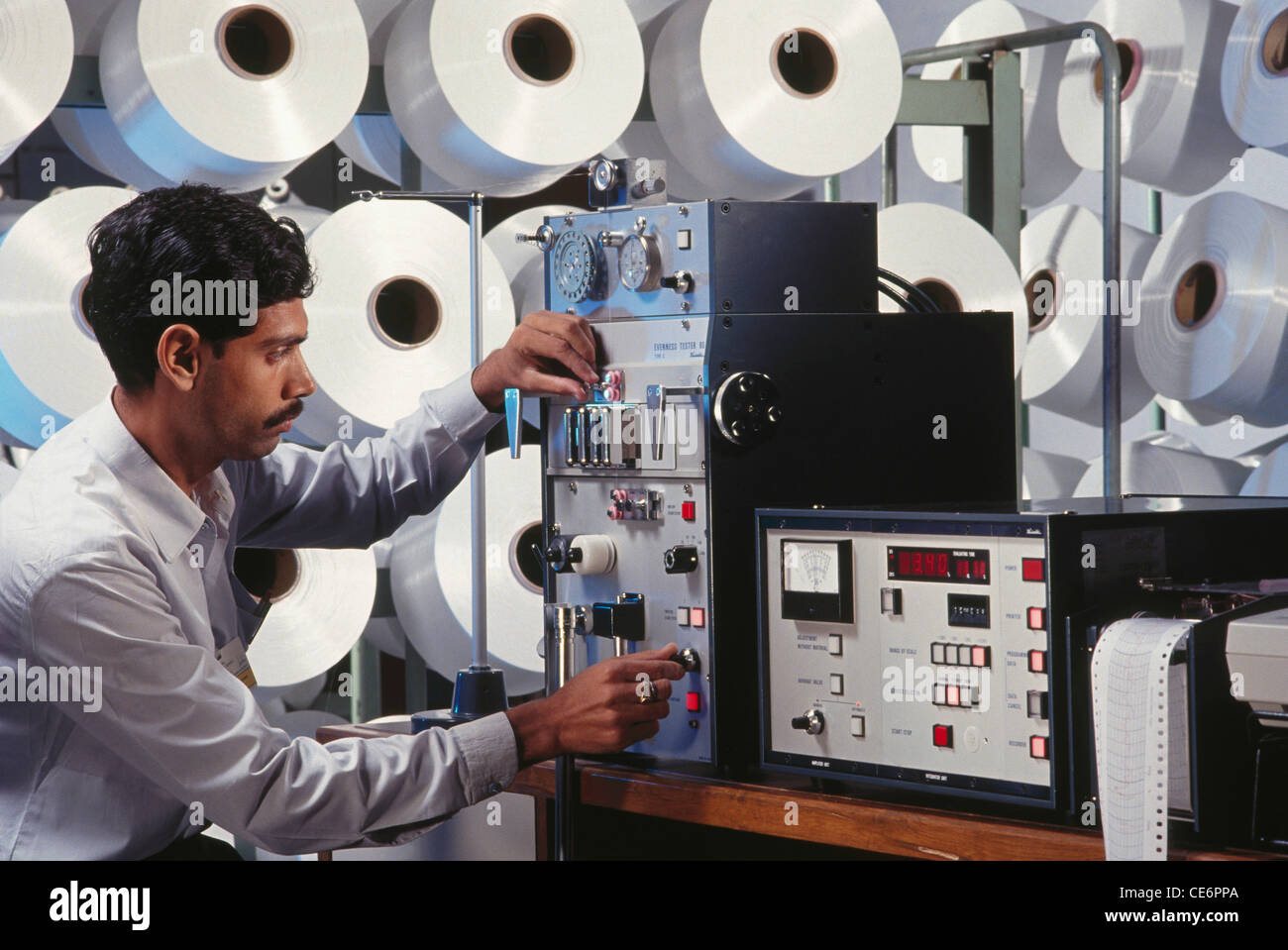 Man working in textile industry quality control ; india Stock Photo - Alamy