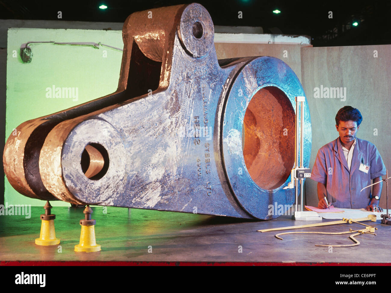 Man working in product quality control section ; india Stock Photo - Alamy
