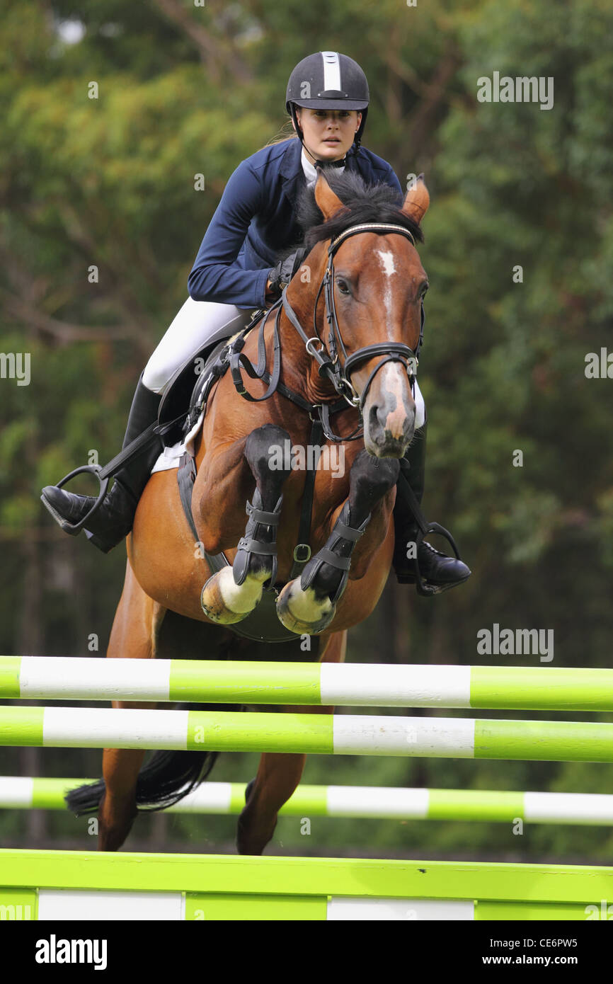 Young Woman Jumping Fence Stock Photo - Alamy