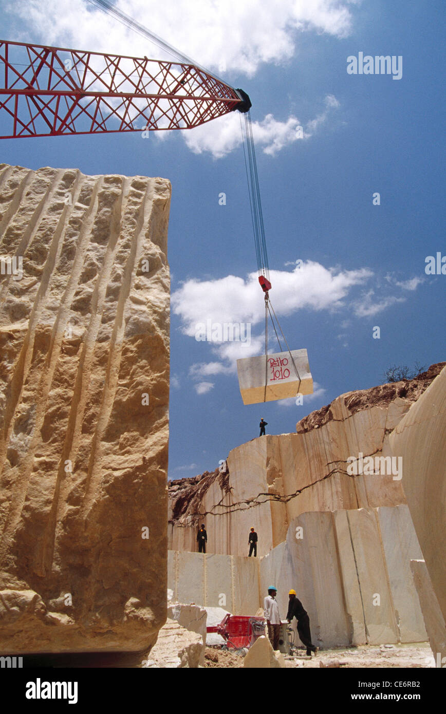 Marble mining ; Mining marble blocks from the wall of the quarry ...