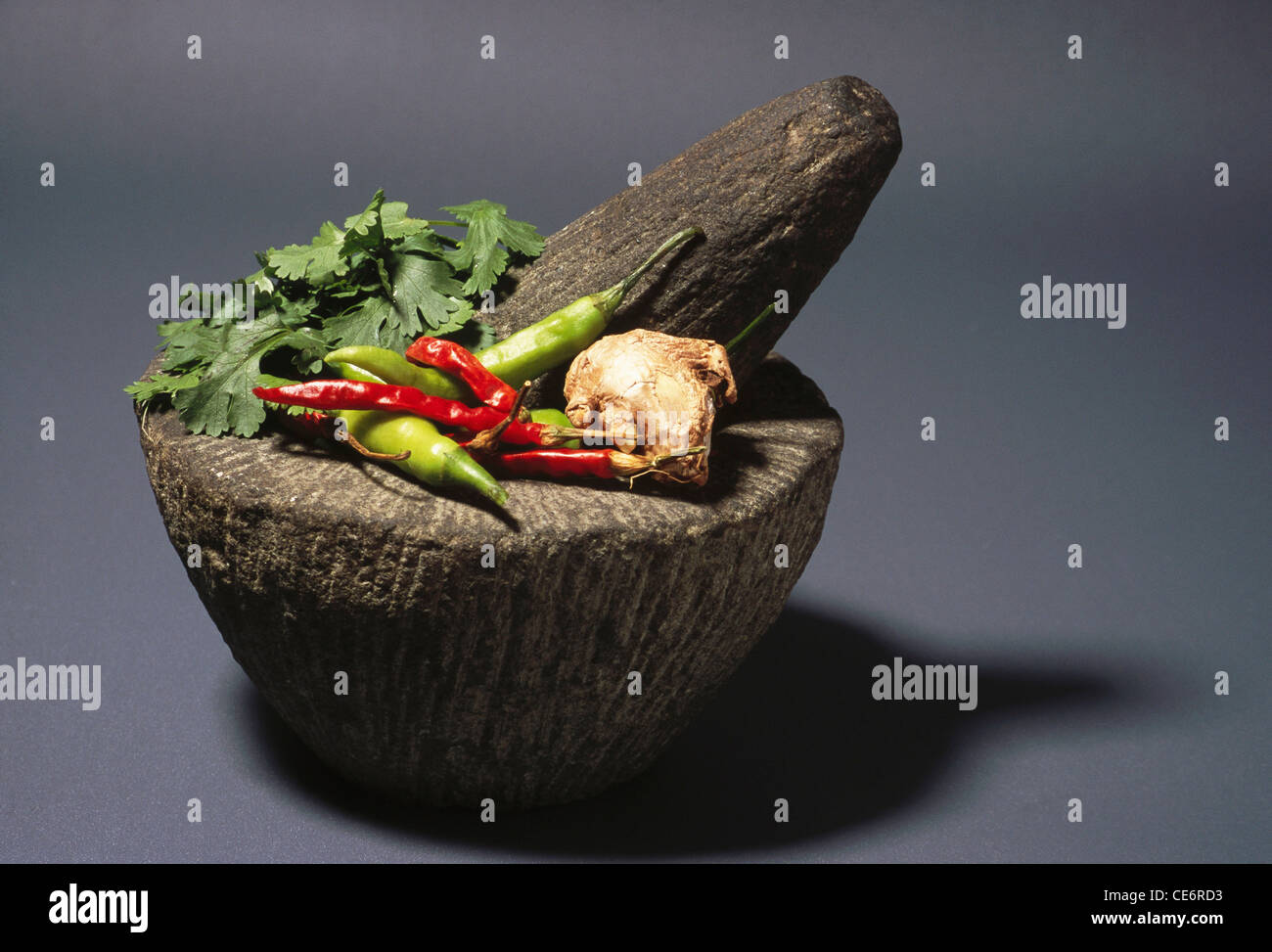 granite stone mortar and pestle ; spices for chutney ; india ; asia ...